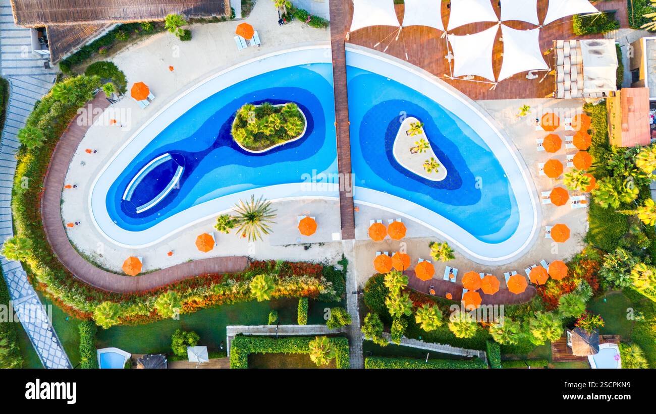 Aerial view of a luxury resort with a uniquely designed wave-shaped ...