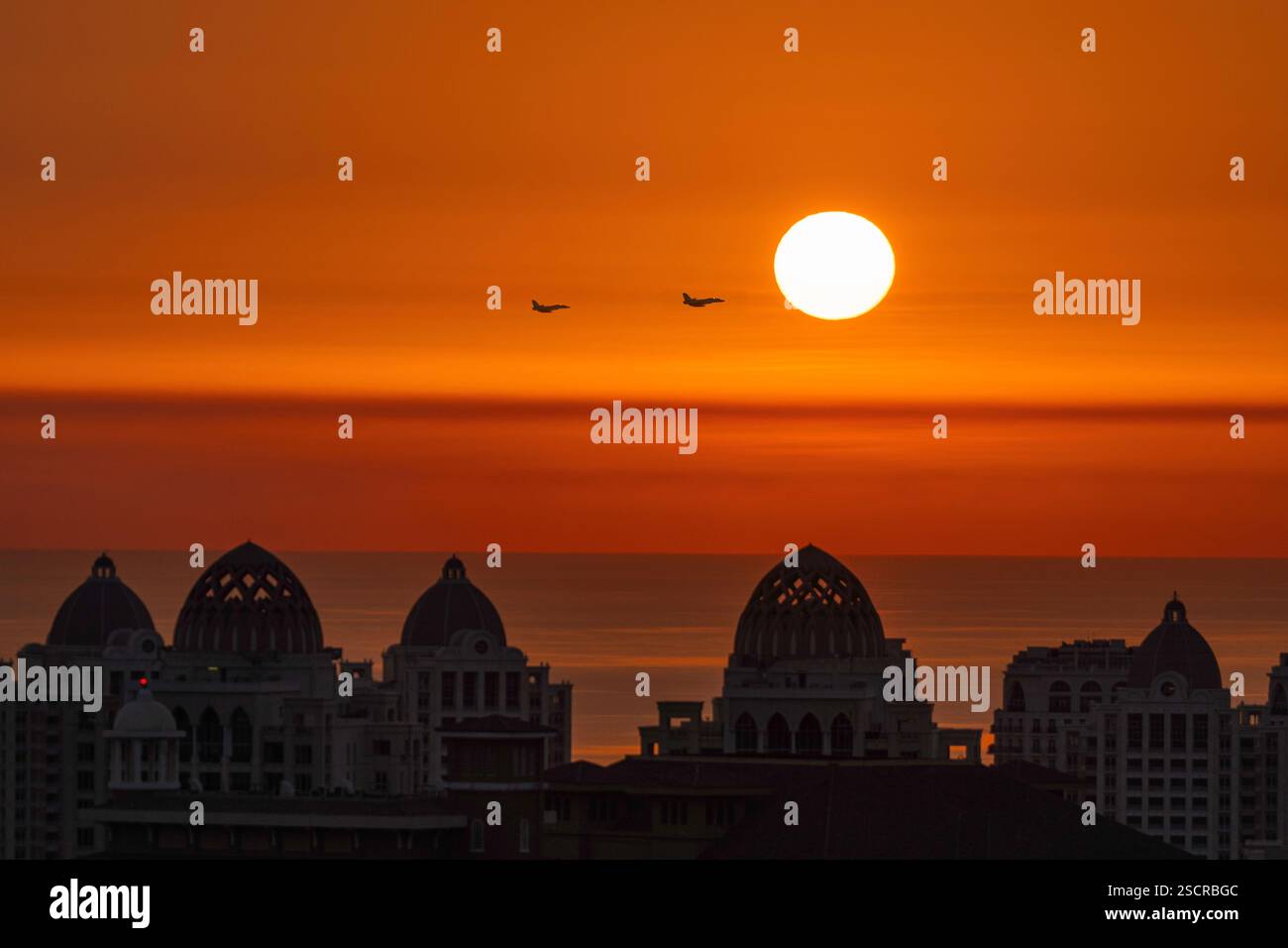 Doha, Qatar - December 20, 2024: Plane is taking off at sunset Pearl ...