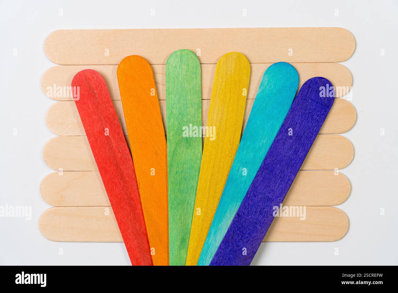 Fan of Rainbow-Colored Craft Sticks Over Natural Popsicle Stick Base ...