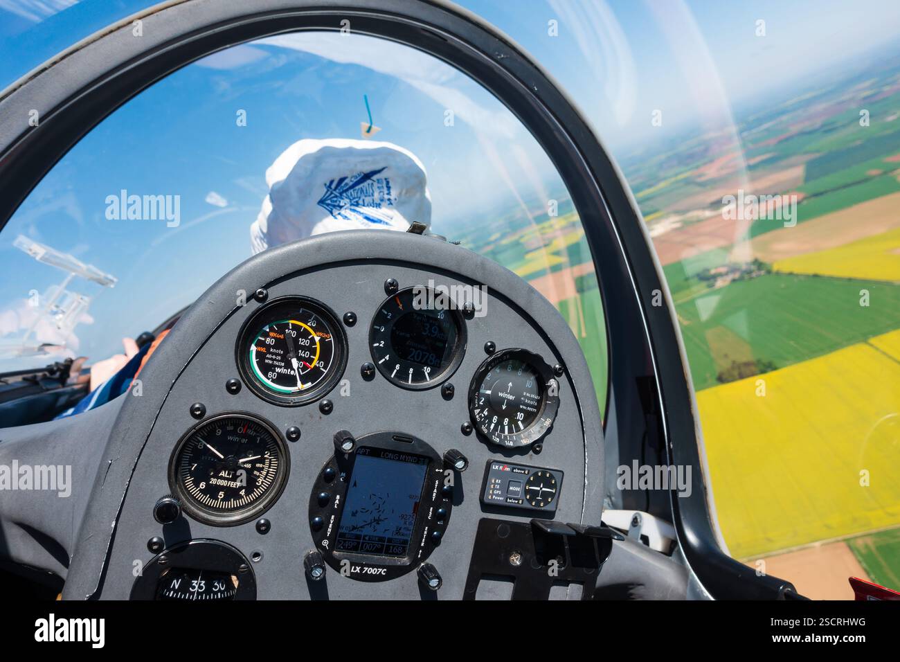 view from rear cockpit of instruments and landscape below flying ...
