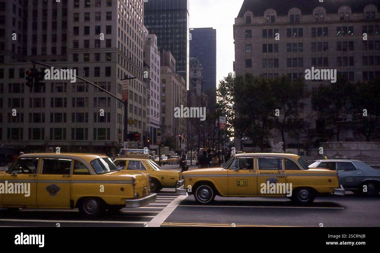 Three typical New York City yellow cabs on a street in Manhattan ...
