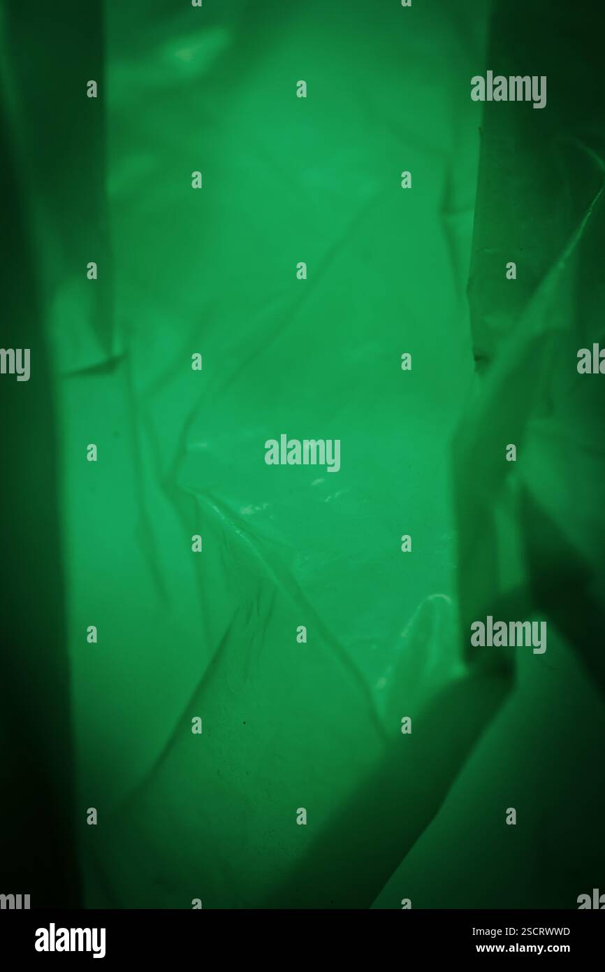 Extreme close up of green empty plastic bag background. The plastic ...
