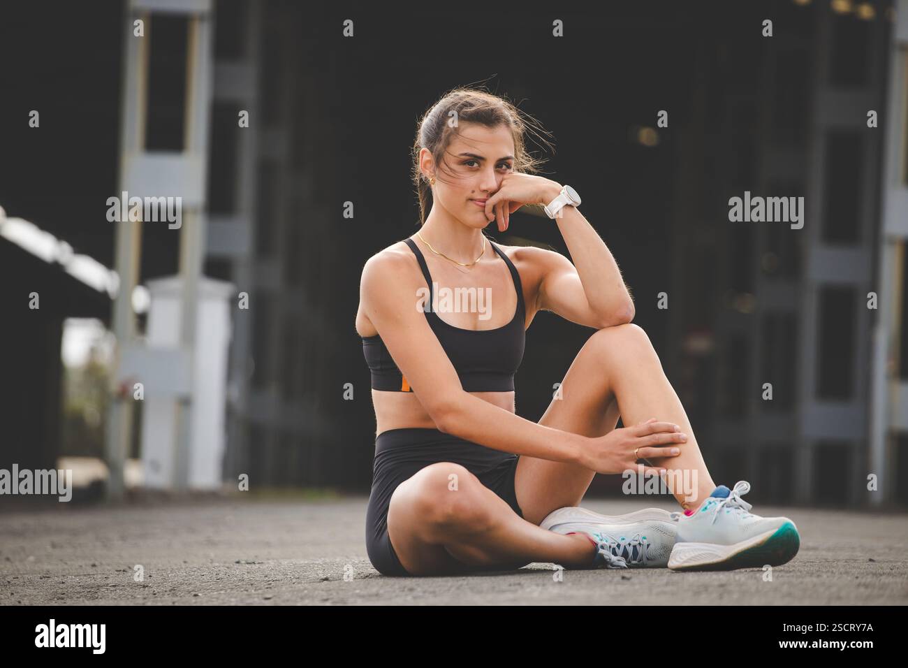 Young female athlete wearing black sportswear, engaging in various ...