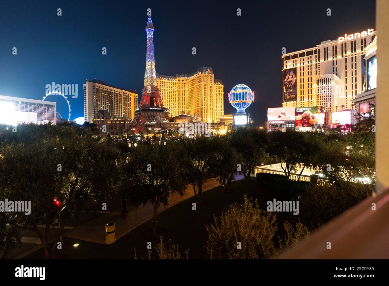 Las Vegas Strip at night, showing the Eiffel Tower, Paris Las Vegas, and other casinos. Iconic ...