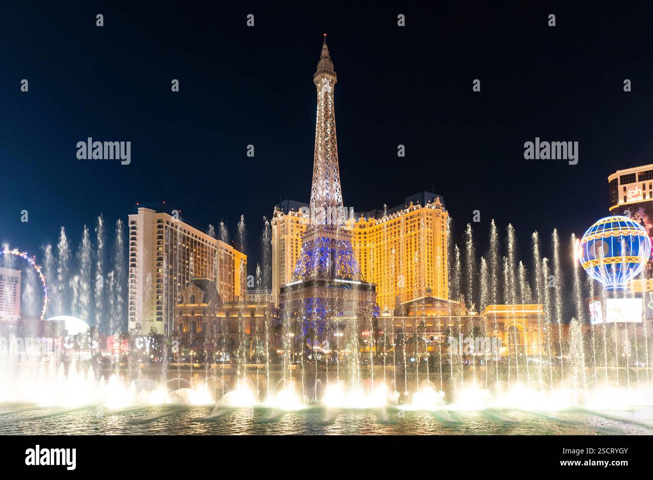 The Bellagio fountains in Las Vegas at night, showcasing a light show ...