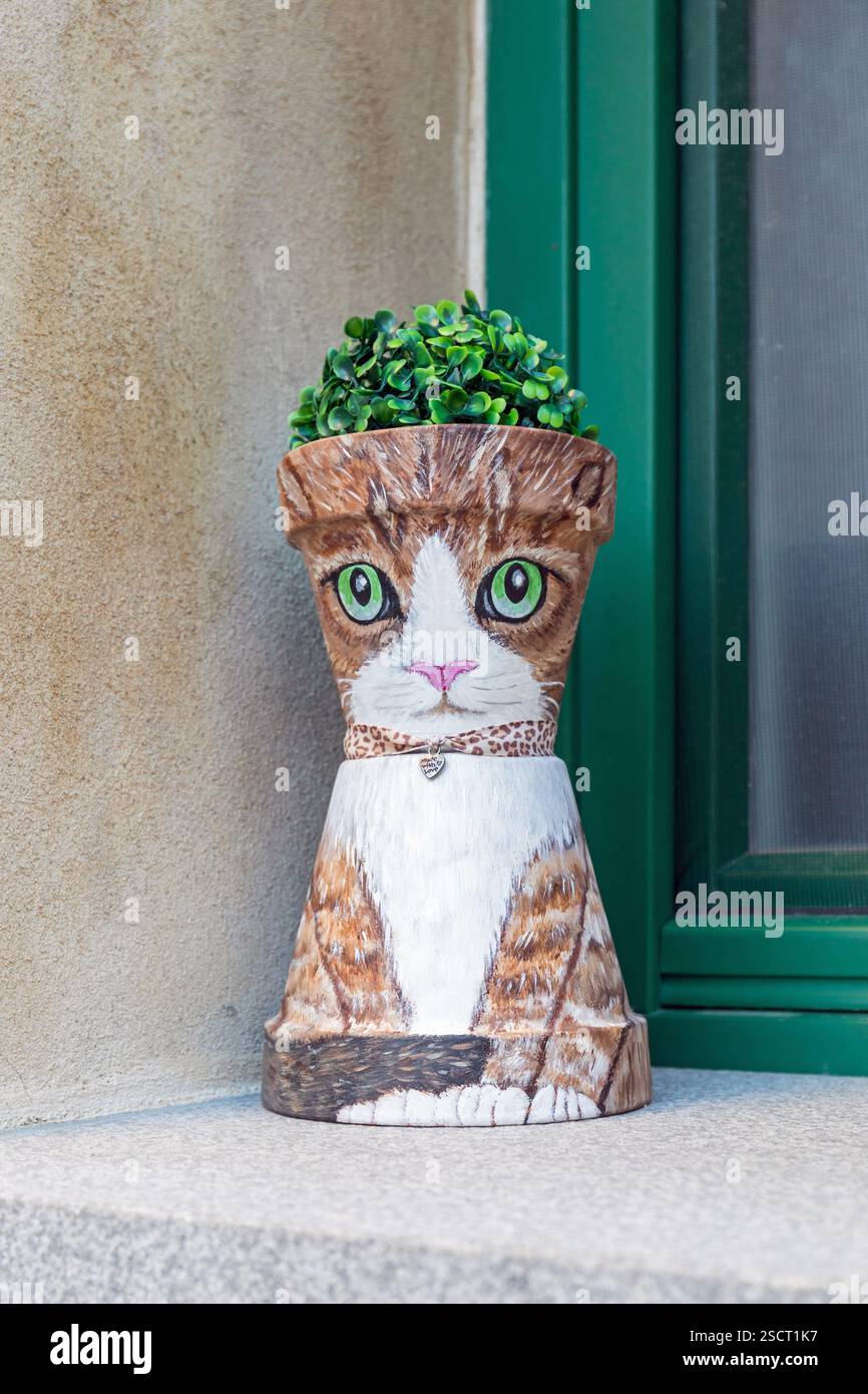 Flower pot in the shape of cat Stock Photo - Alamy