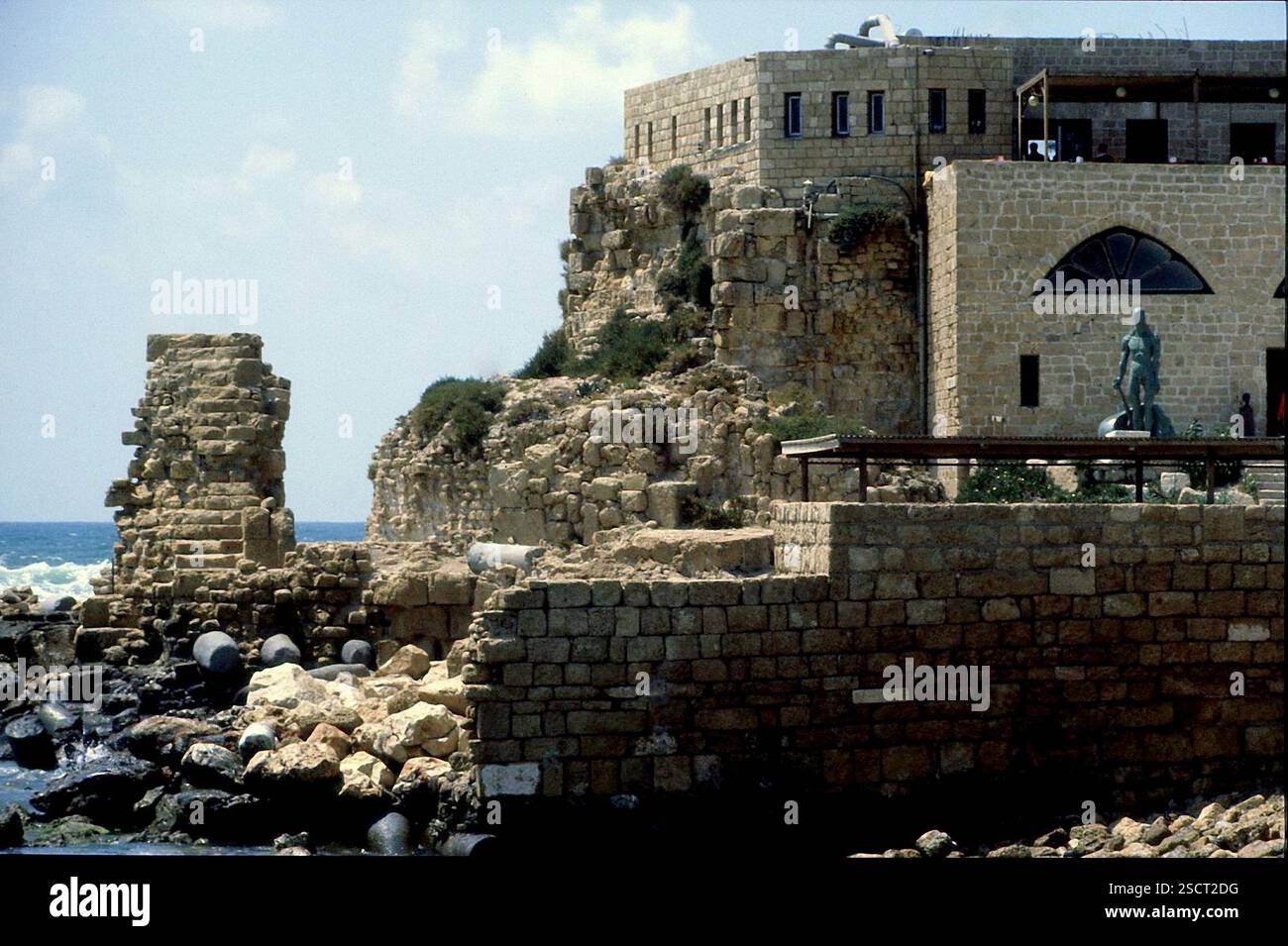 A modern building on the ruins of an ancient city in the Caesarea ...