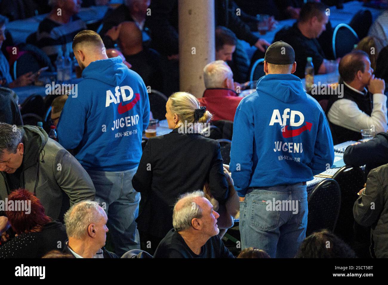 07 February 2025, Bavaria, Greding: Two men wear hoodies with the inscription "AfD Youth" at an ...