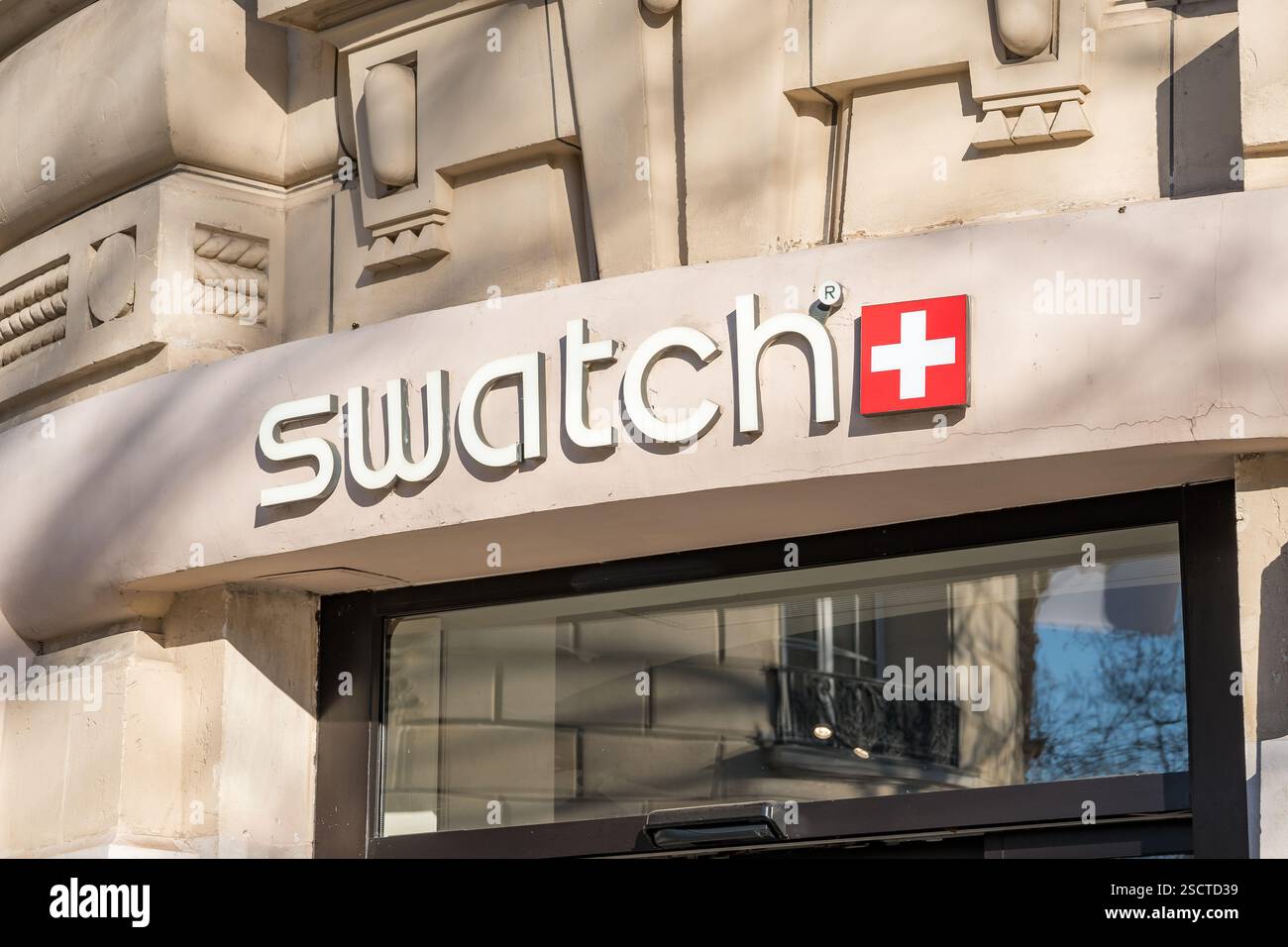 Elegant storefront showcases Swiss timepieces in vibrant urban setting ...