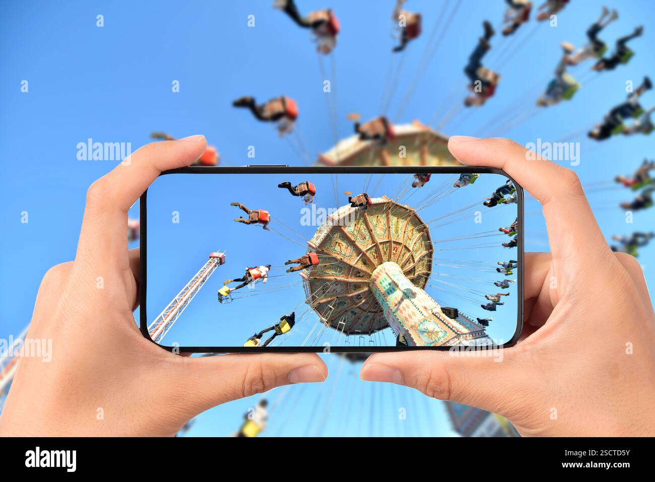 Cell phone taking a picture of people on a ride at the Washington State ...