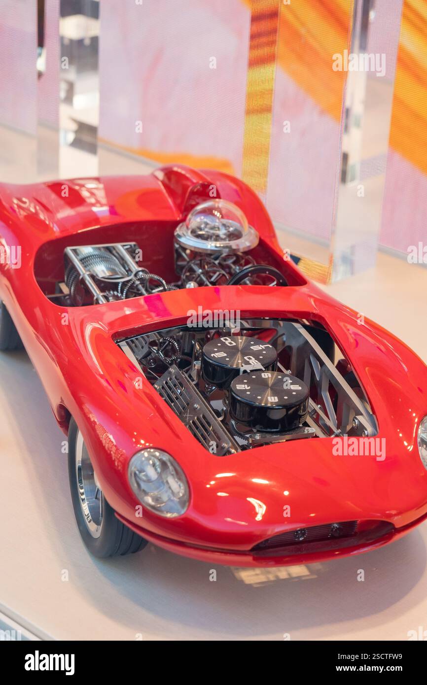 Classic red racing car model showcases intricate details and ...