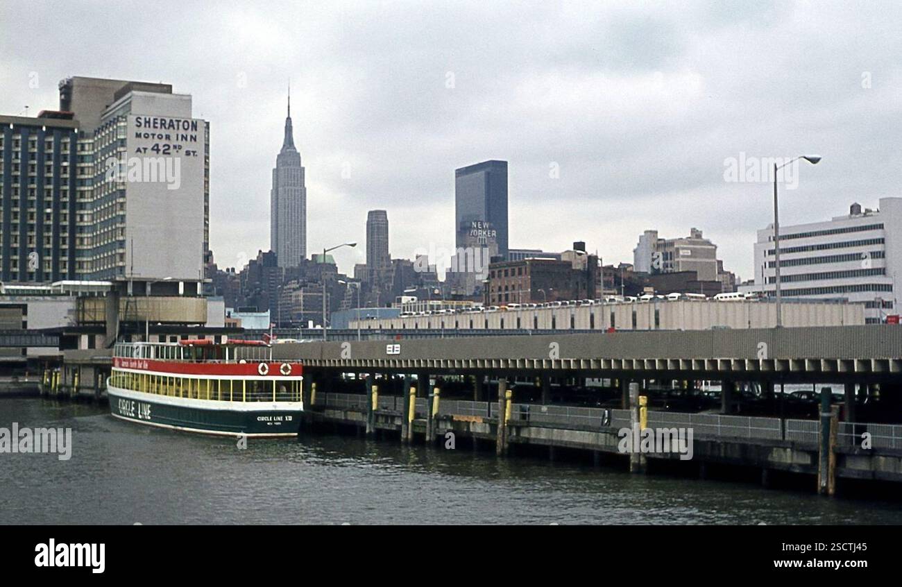 A ferry at a landing stage on the Hudson River in New York. The ...