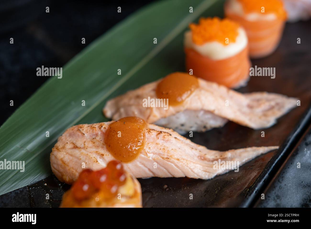 Set of Salmon aburi sushi with saikyo sauce on plate Stock Photo - Alamy