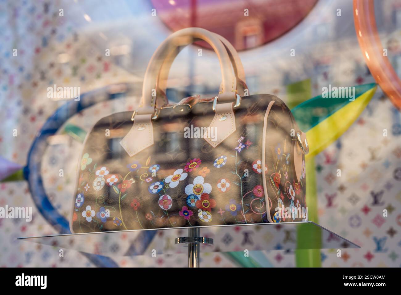 Stylish floral handbag showcased in a boutique window display in the ...