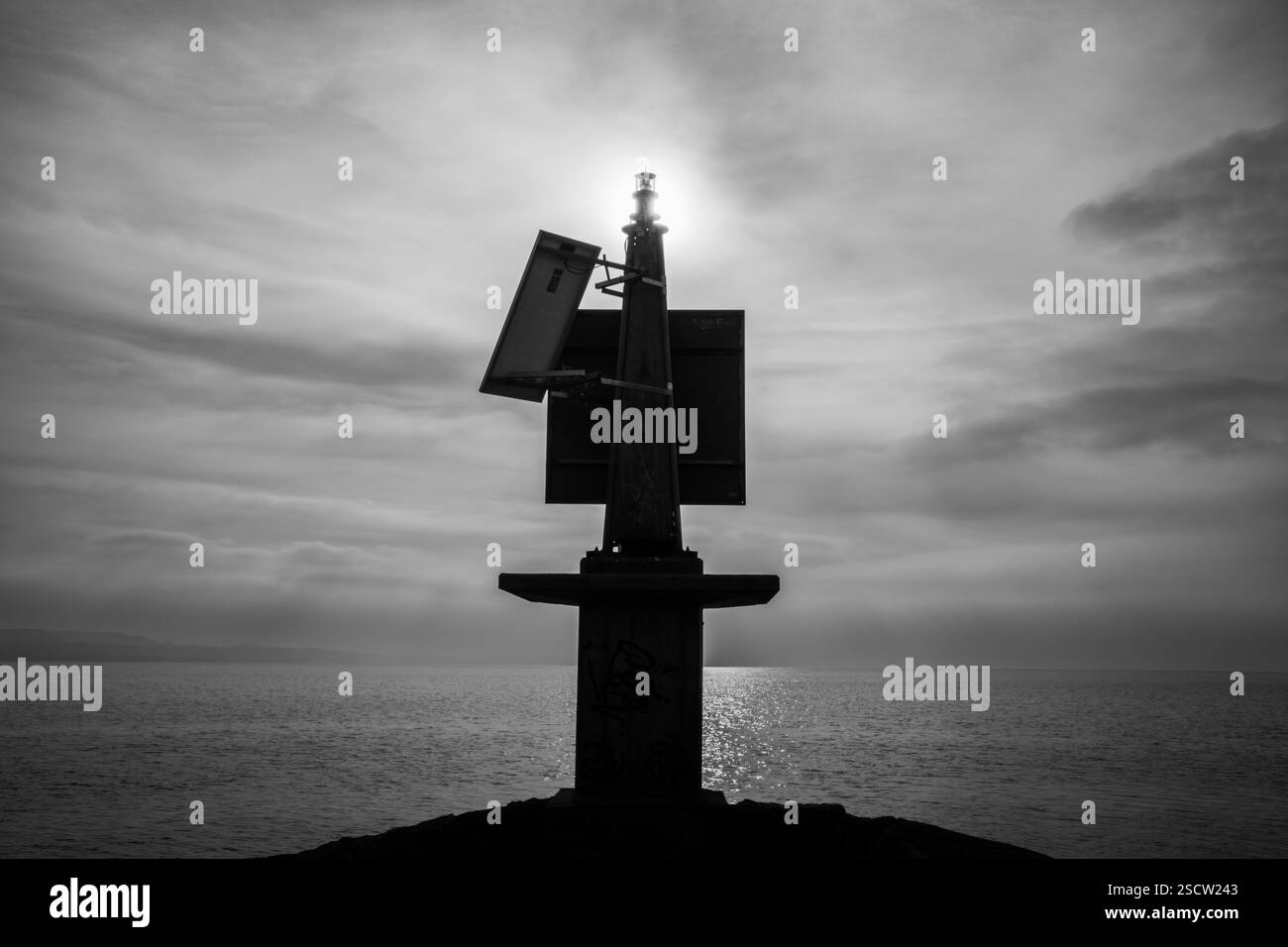 Beacon at the end of a pier Stock Photo - Alamy