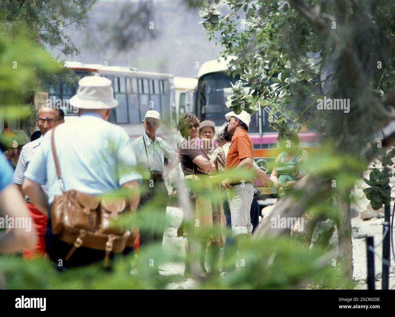 Tourists at a bus station near Masada in Israel. [automated translation ...