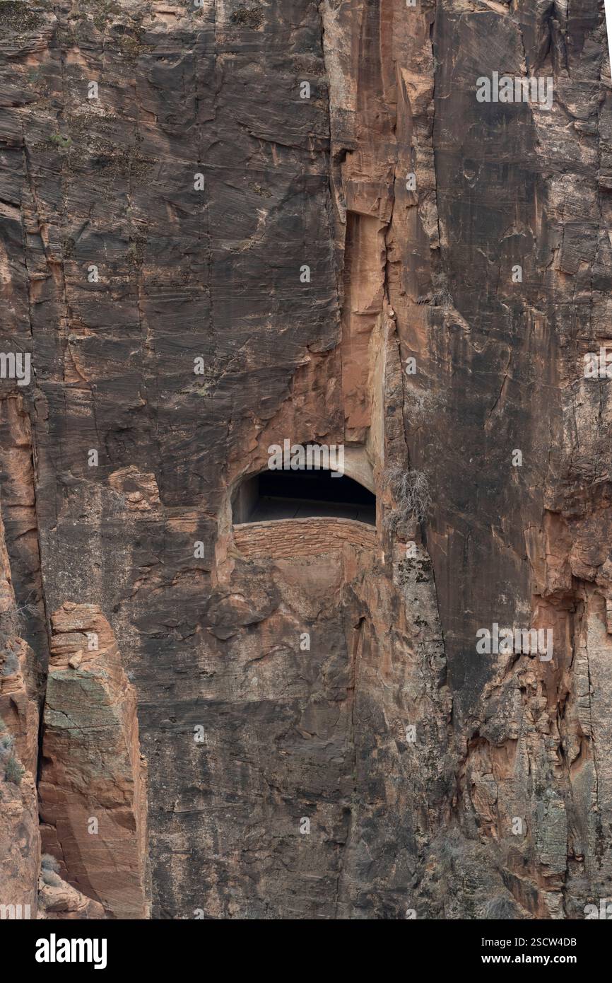 A small alcove with a brick structure, carved into the sandstone cliffs ...