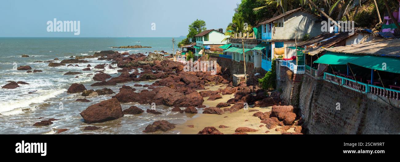 Arambol beach, stones, houses, North Goa, India Stock Photo - Alamy