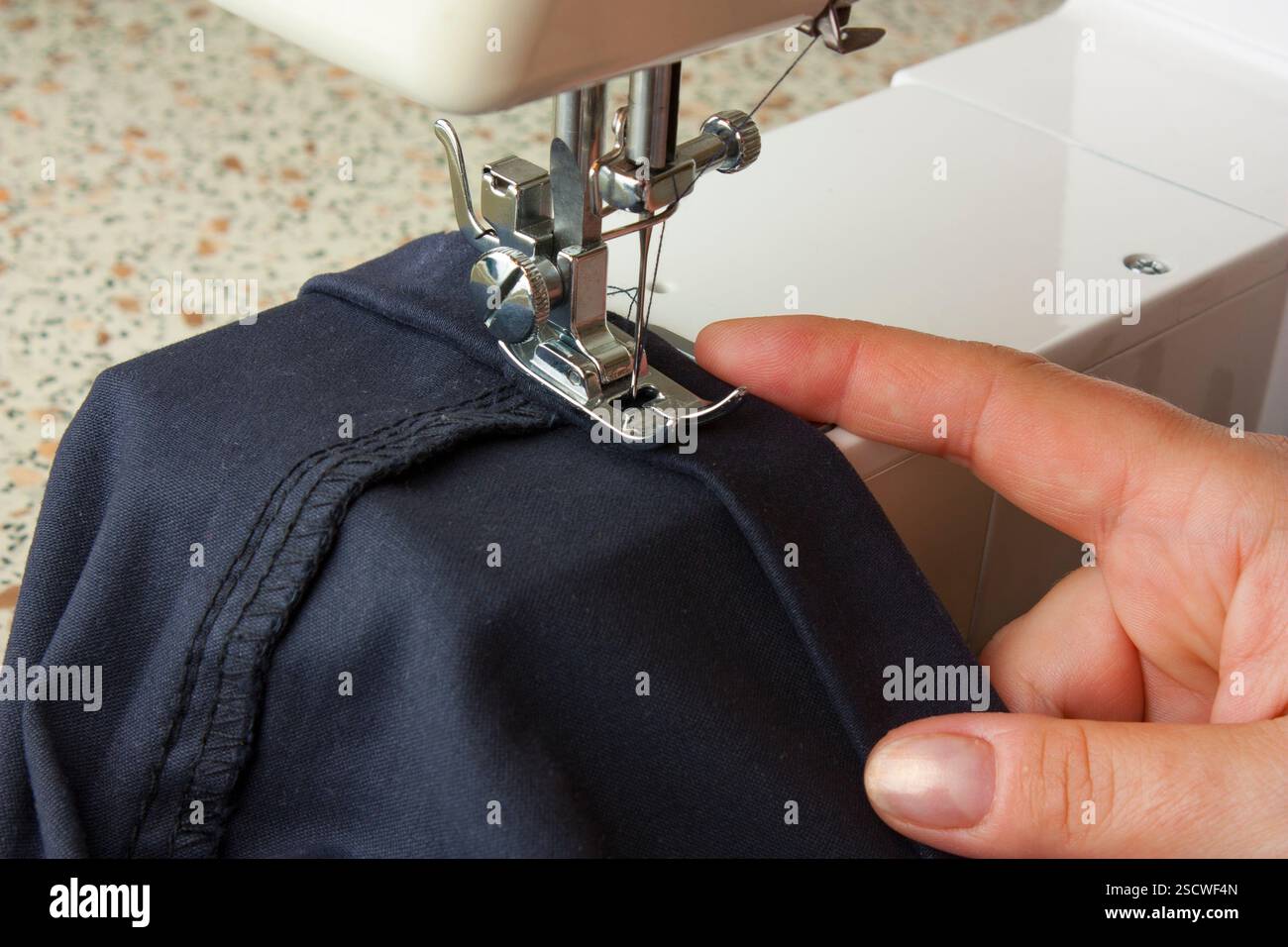 sewing machine and item of clothing Stock Photo - Alamy