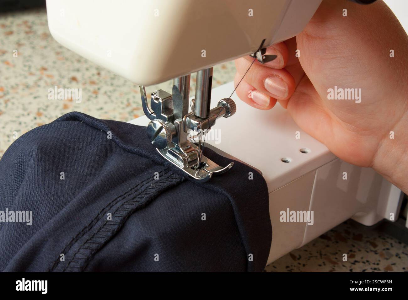 sewing machine and item of clothing Stock Photo - Alamy