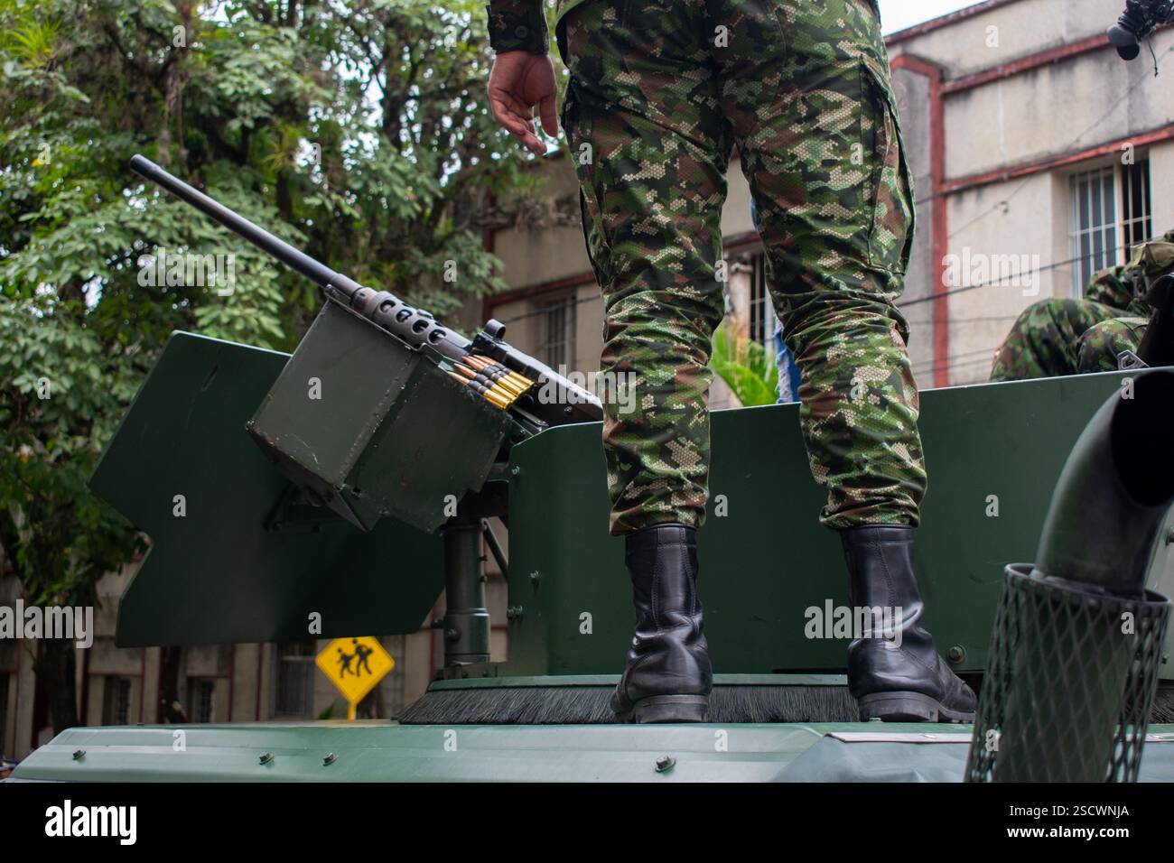 soldier next to long-range machine gun, military personnel with heavy ...