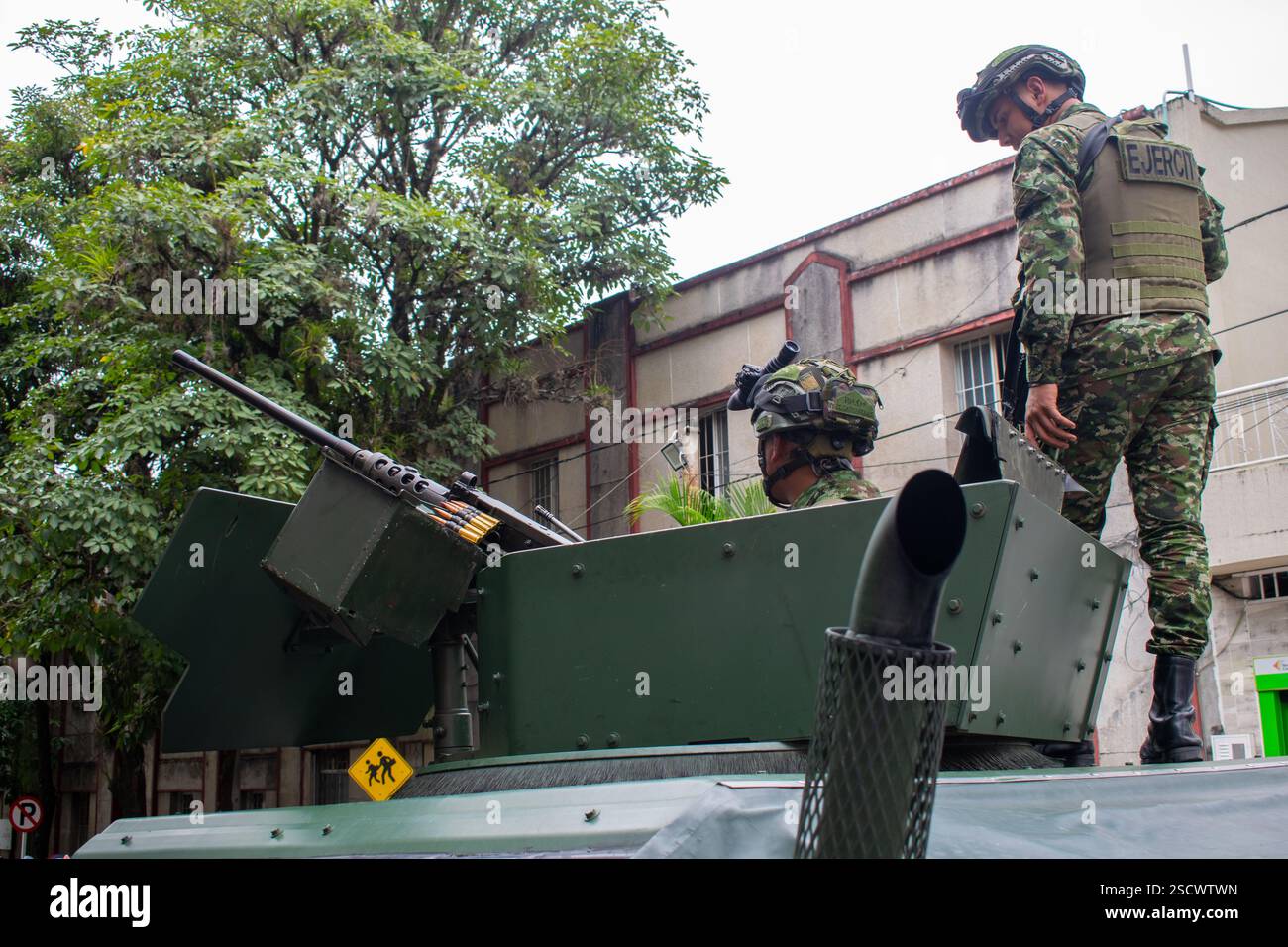Soldiers in military vehicle with mounted machine gun, military forces ...