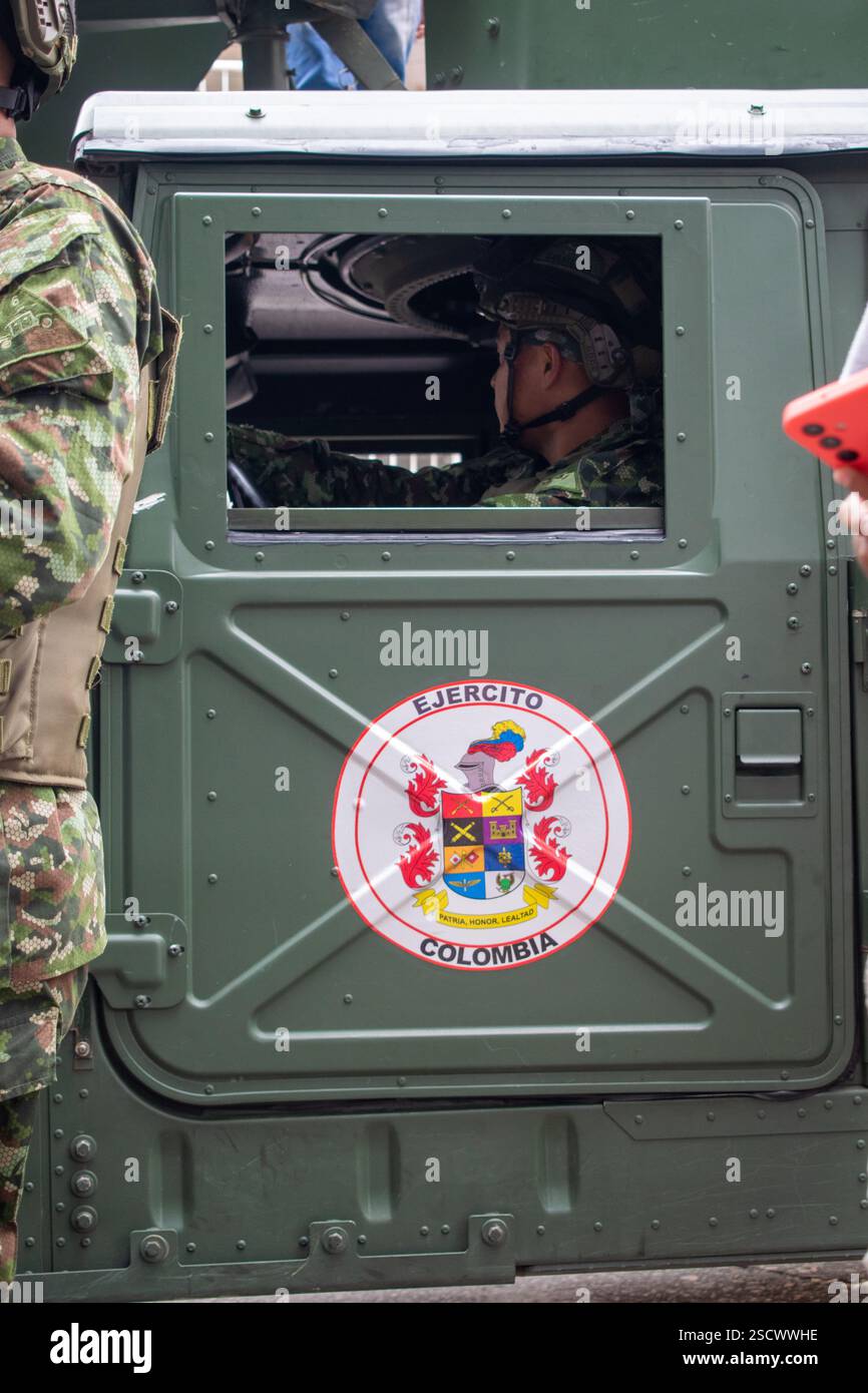 Soldier on an armored vehicle, Military personnel atop an armored ...