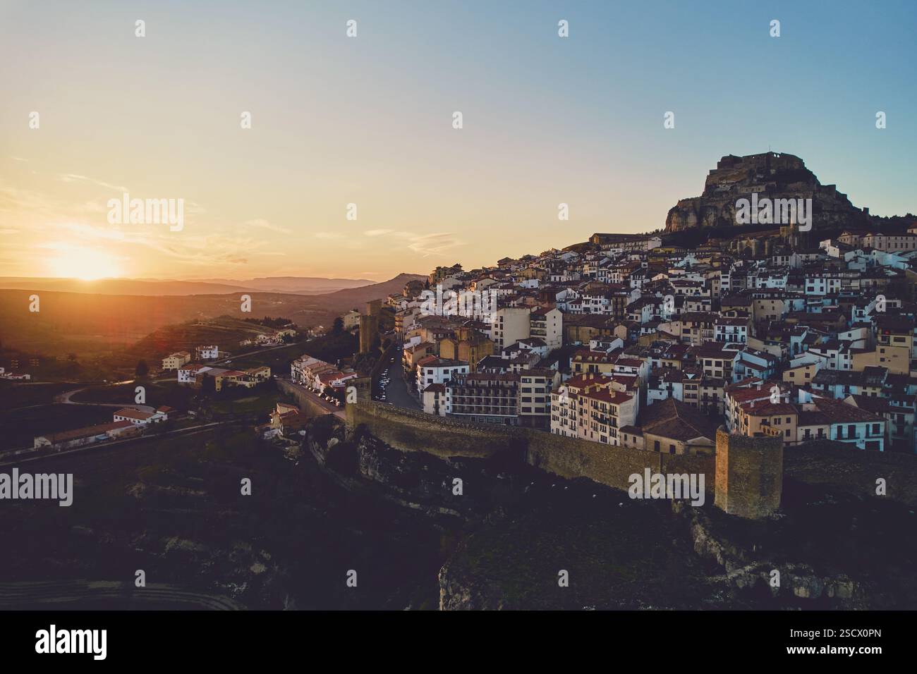 Aerial above view of historic medieval town of Morella during sunset ...