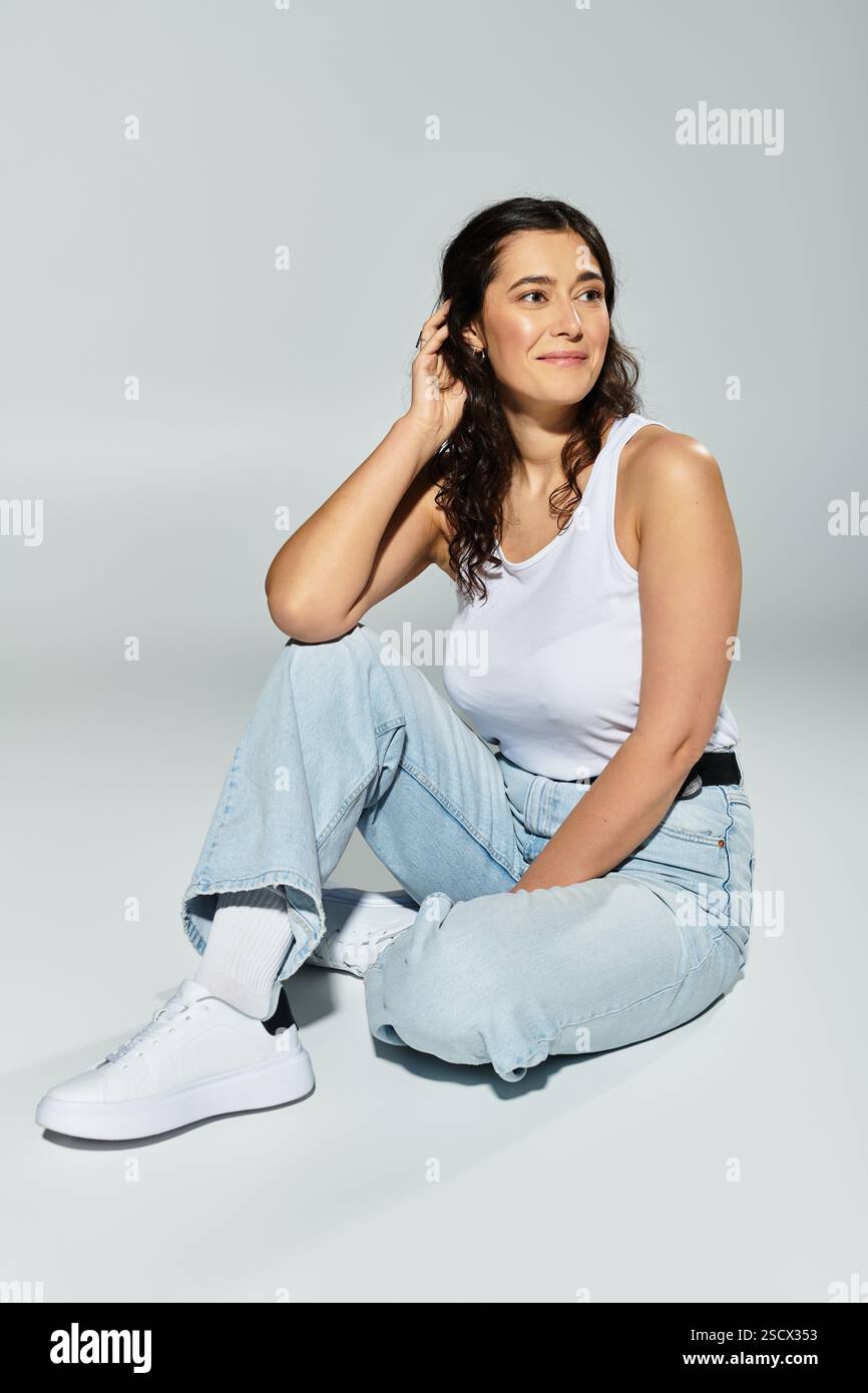 Plus size woman relaxing in a beautiful studio setting with a cheerful ...