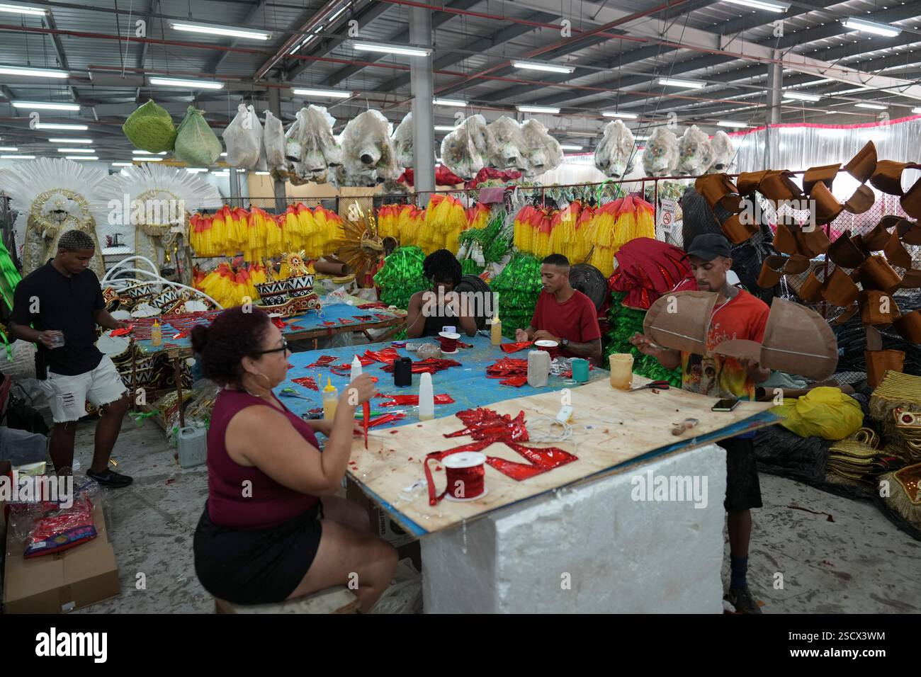 Members of the "Unidos de Padre Miguel" samba school prepare ...