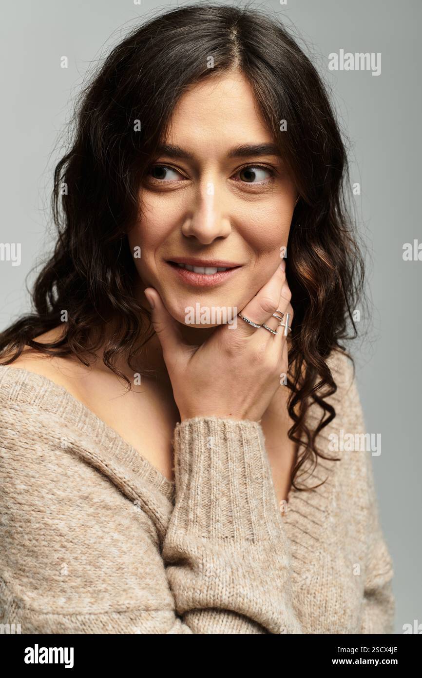 Woman smiles gently in studio hi-res stock photography and images - Alamy