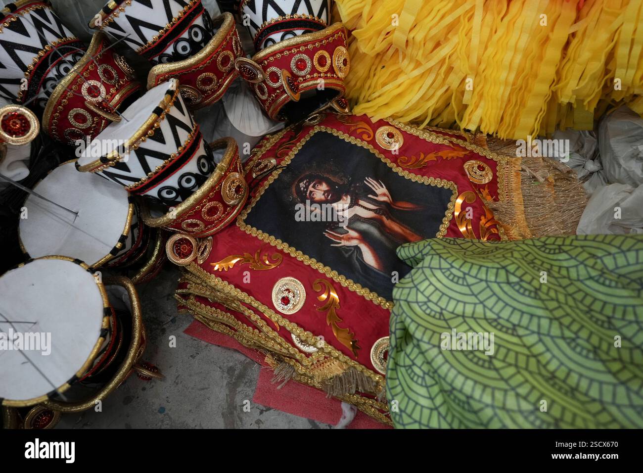 An image of Jesus lays amid costume pieces at the "Unidos de Padre ...