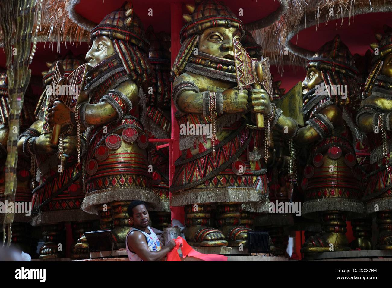 A member of the "Unidos de Padre Miguel" samba school prepares a float ...