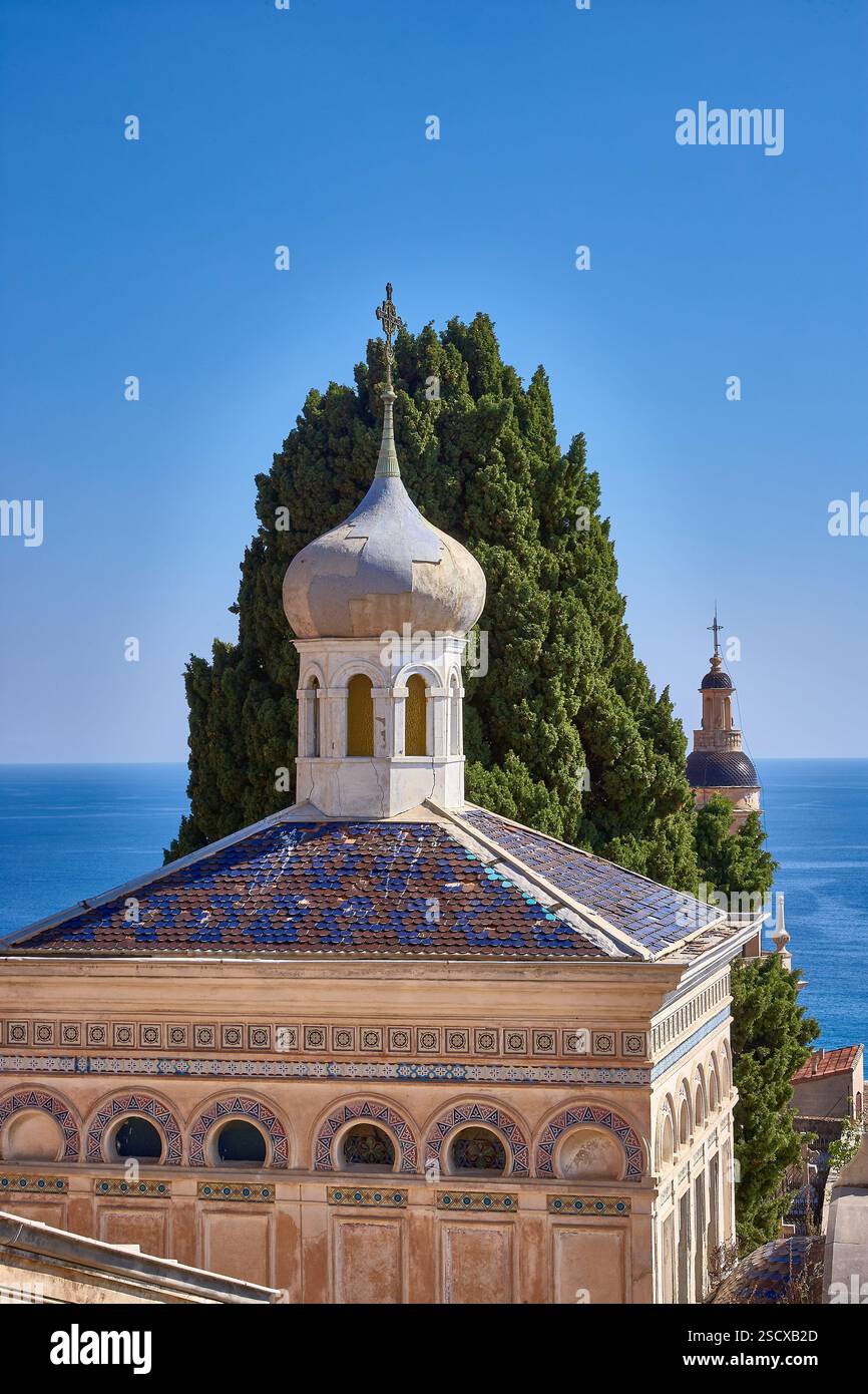 Mediterranean Church Dome Against Clear Blue Sky and Lush Greenery in ...