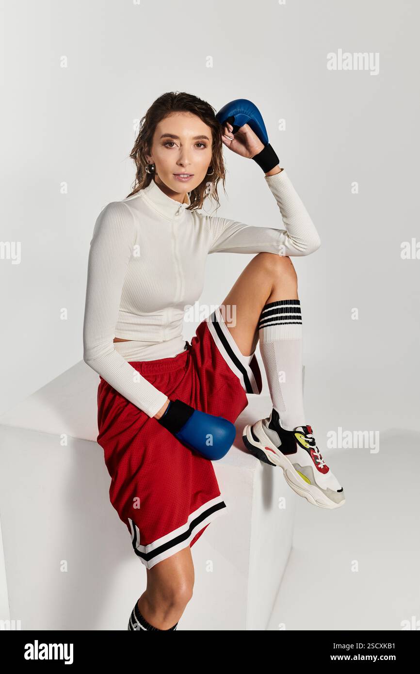 Young beautiful woman in sporty attire showcasing modern athletic ...