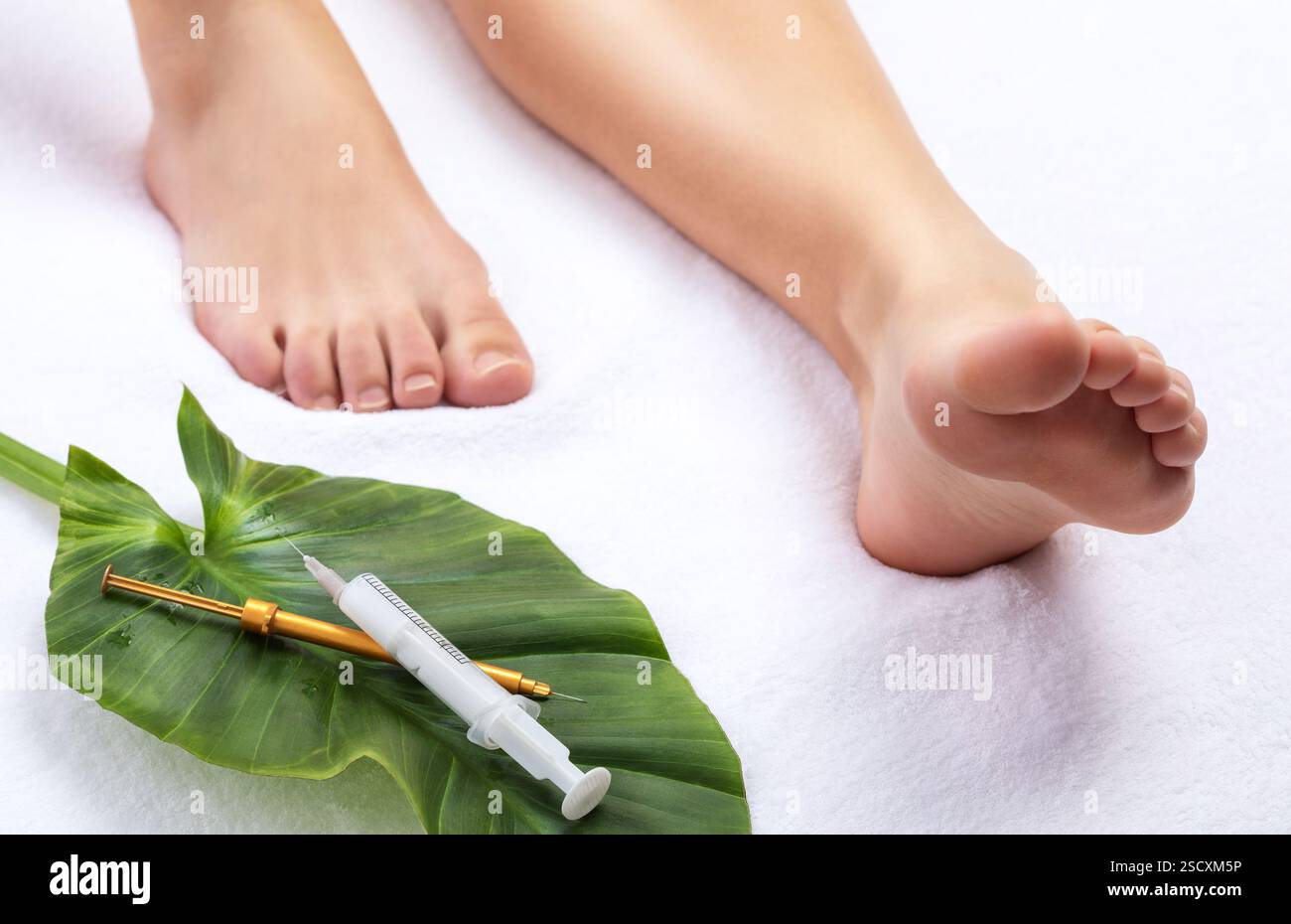 doctor cosmetologist makes injections of botulinum toxin on the feet of ...