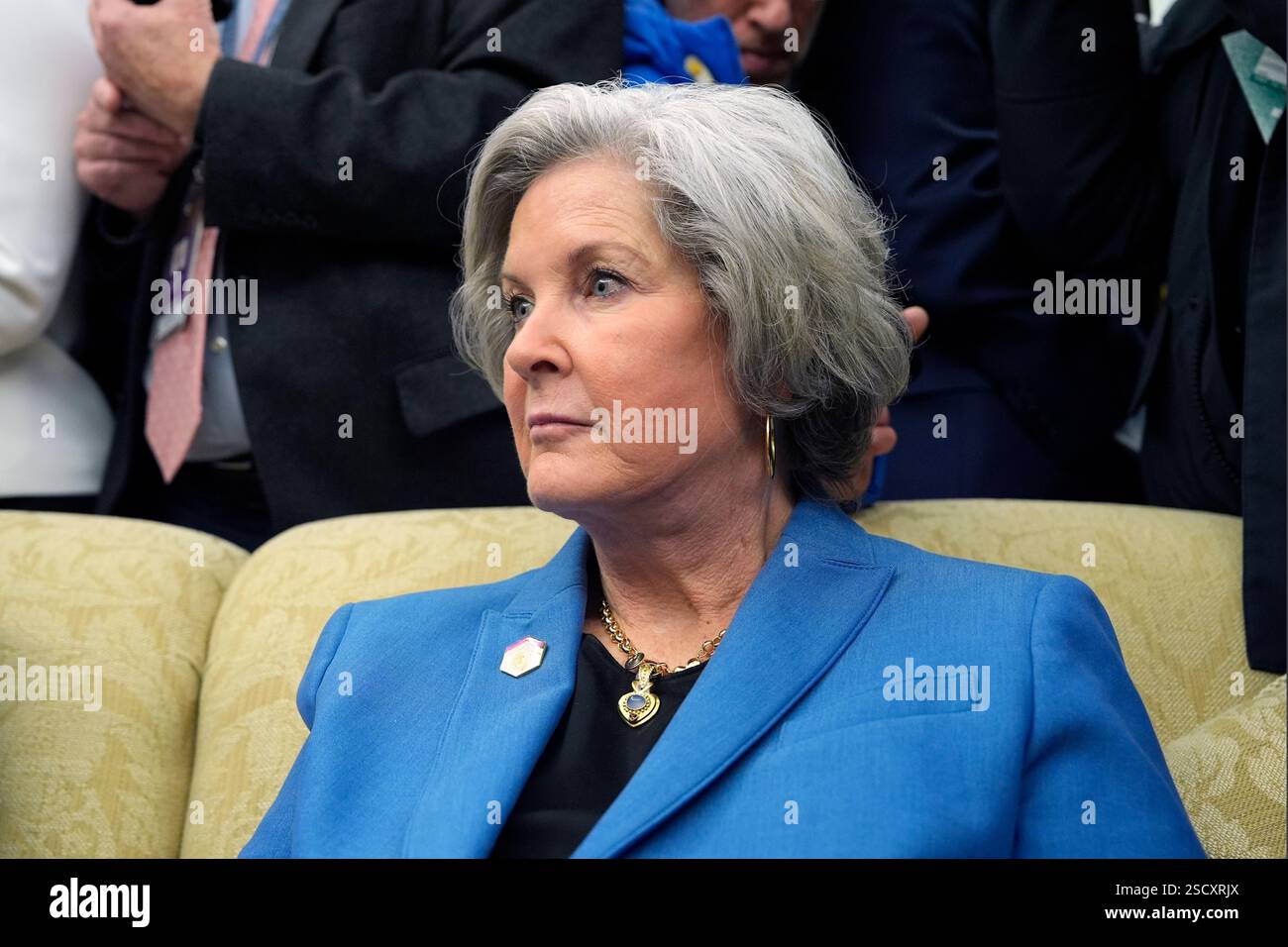White House Chief of Staff Susie Wiles listens as President Donald ...