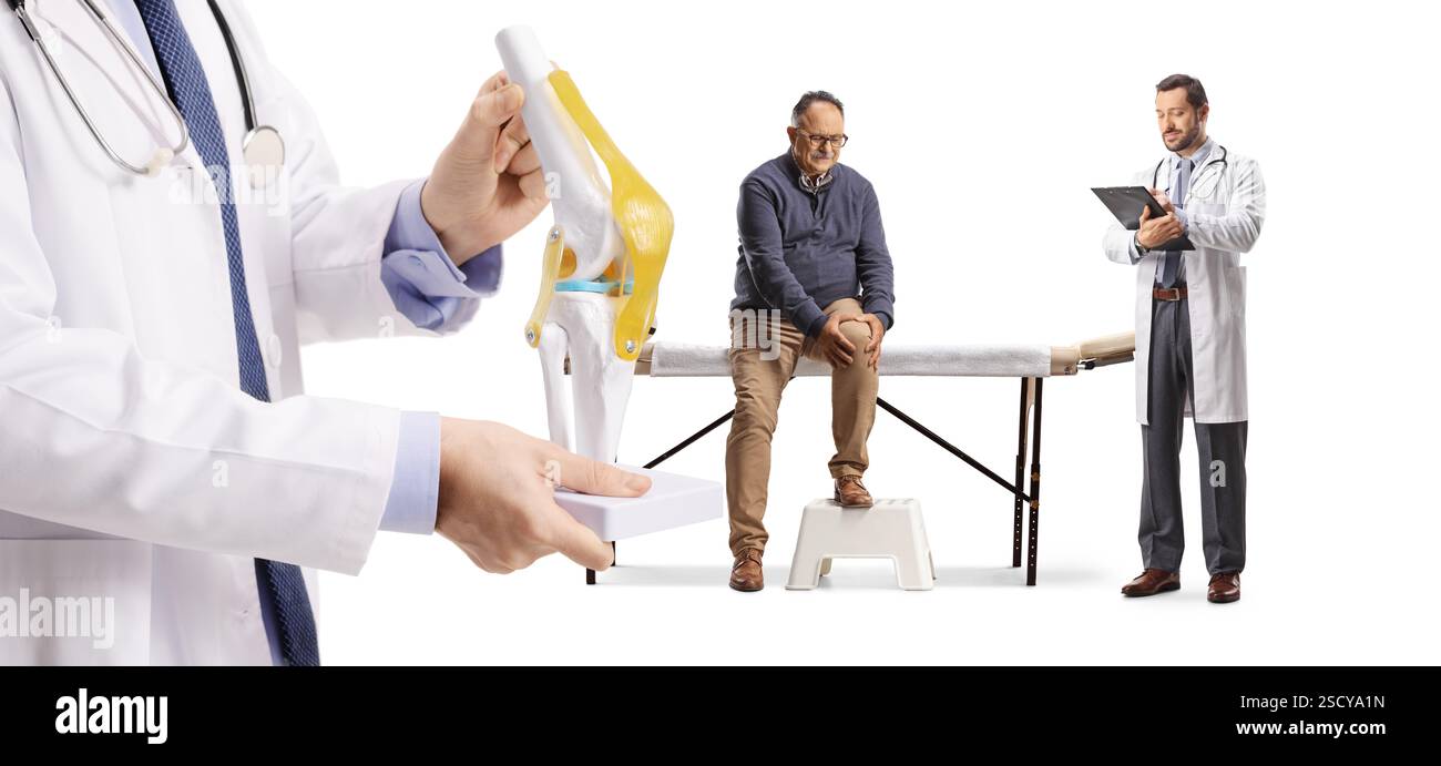 Man with a knee injury and doctor holding a model of a human knee bone ...