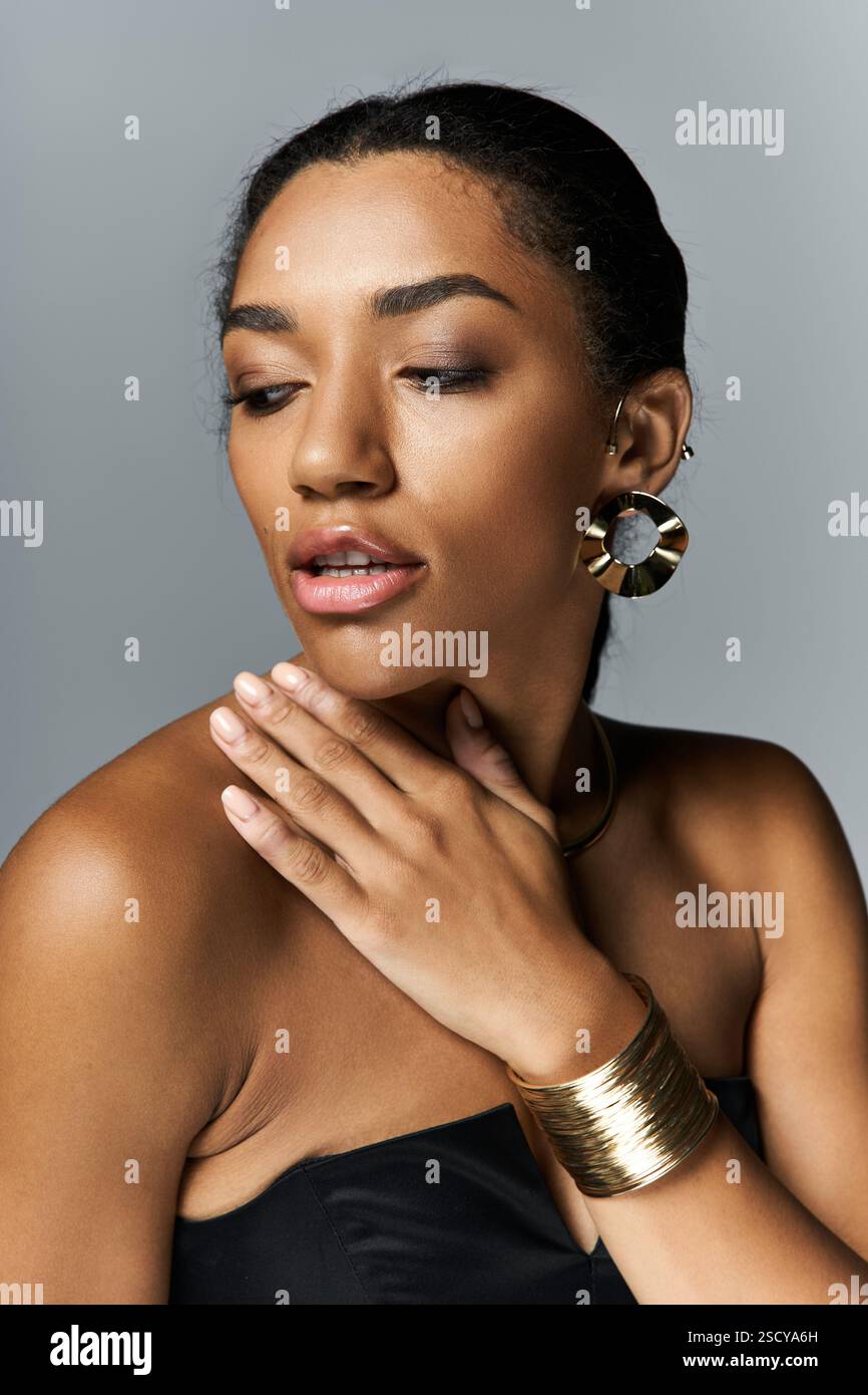 Young woman models elegant attire with chic accessories in an artistic ...