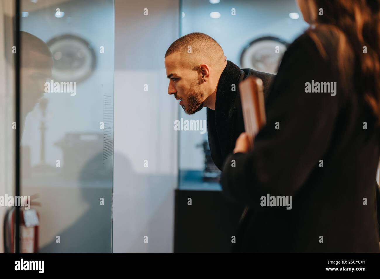 Man Observing Display in Modern Art Museum Exhibit Area Stock Photo - Alamy