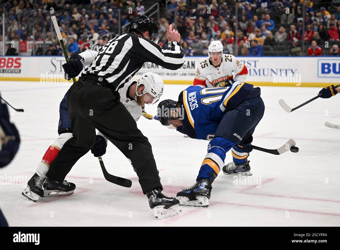 St. Louis Blues' Brayden Schenn (10), right, wins a face-off against ...
