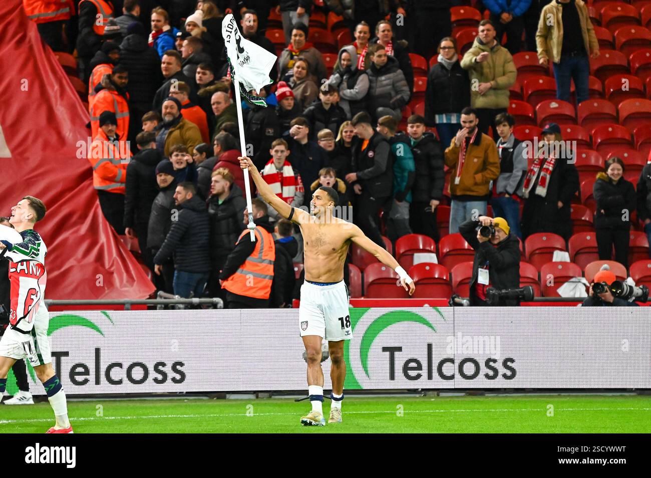 Wilson Isidor lifts a corner flag at full time to celebrate Sunderland ...