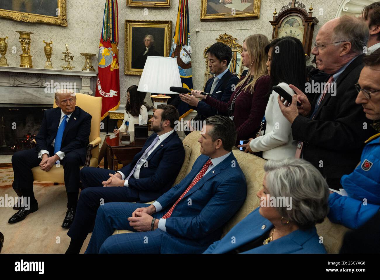 US President Donald Trump responds to questions from reporters during a ...