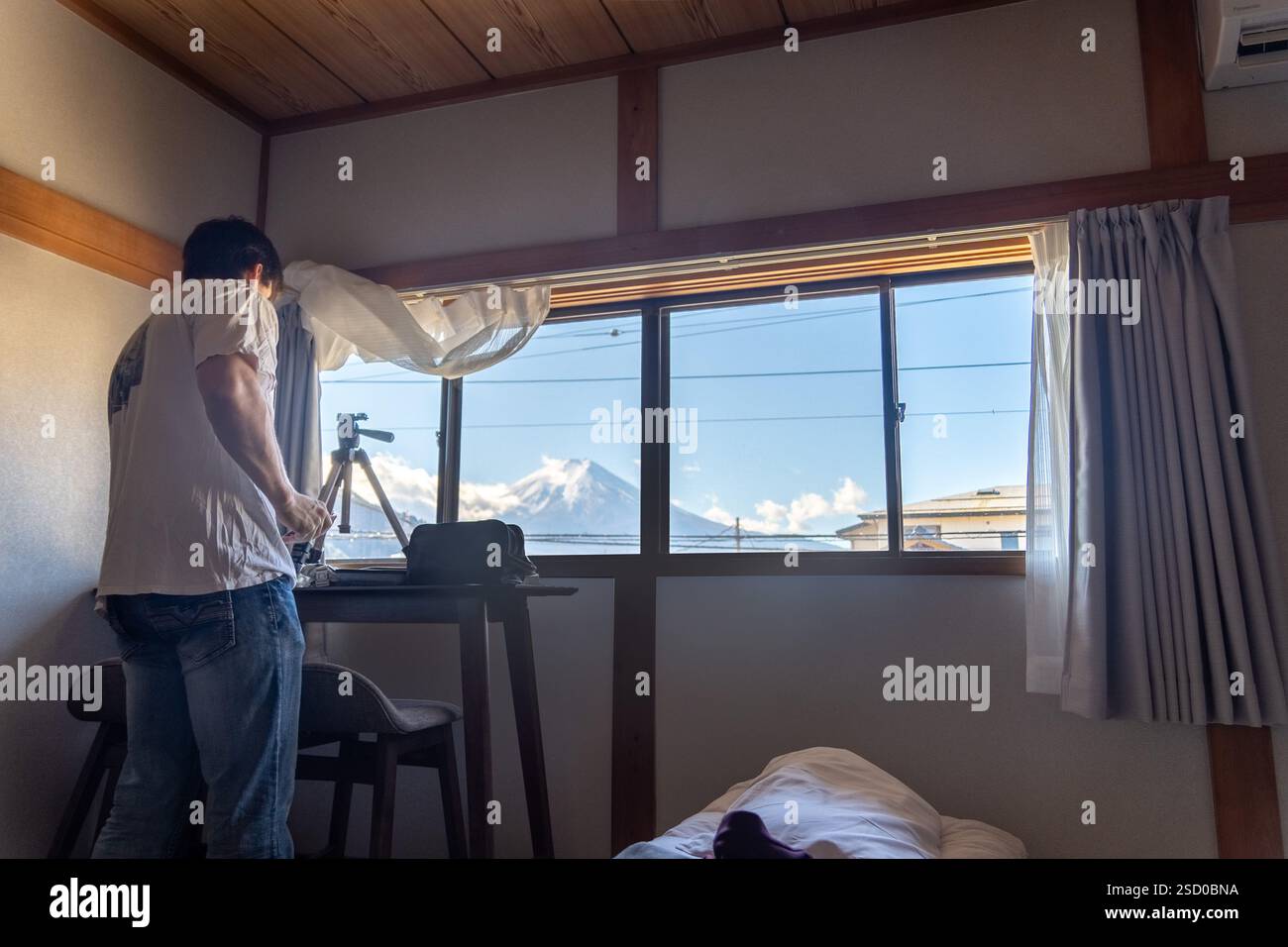 Capturing the beauty of Mount Fuji from a cozy room in Japan. High ...