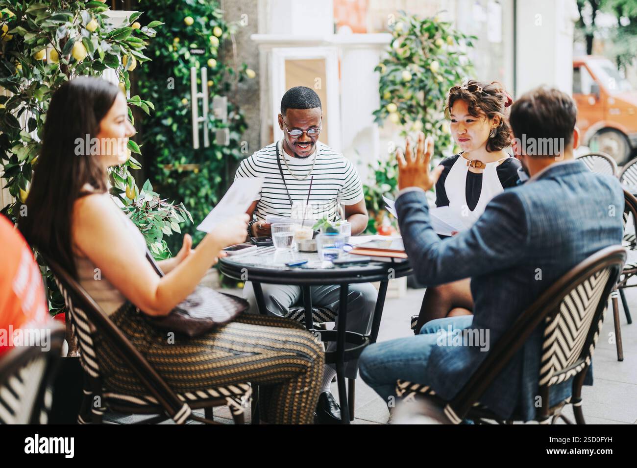 A diverse group of professionals engaging in a collaborative discussion ...