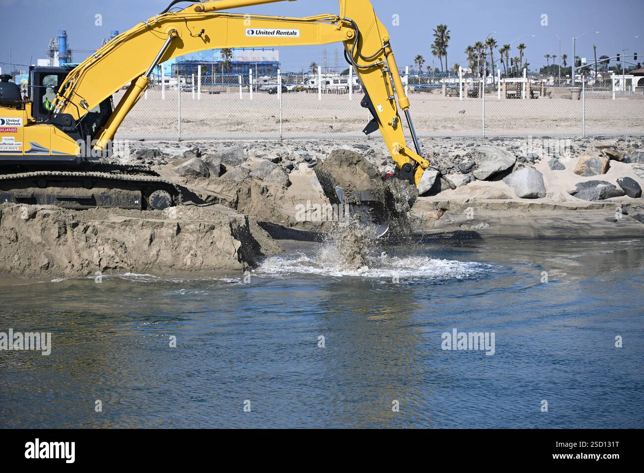 HUNTINGTON BEACH, CALIFORNIA: 29 JAN 2025: Workers Dredging the mouth ...
