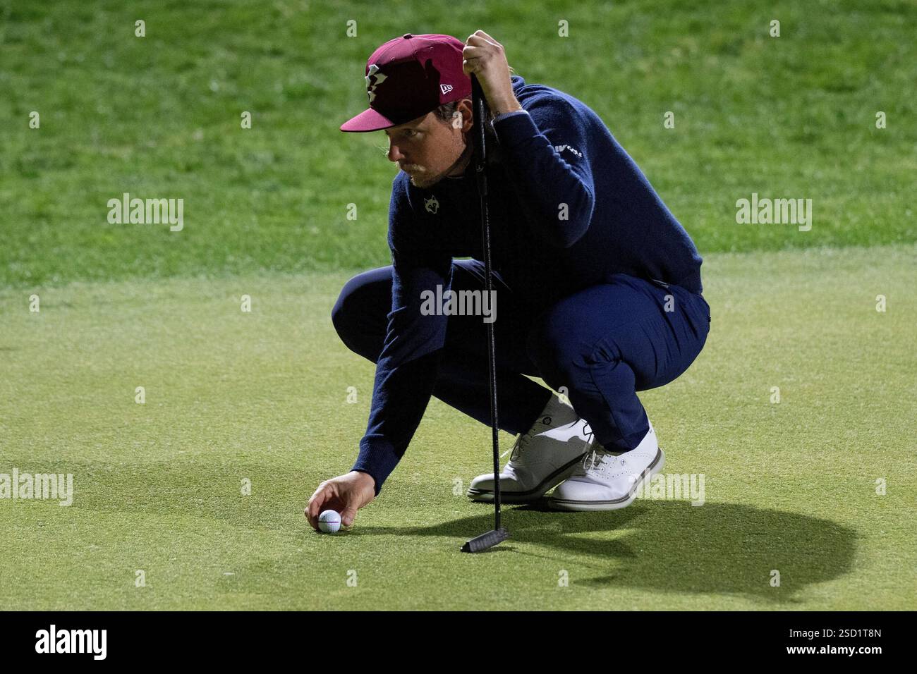 Captain Cameron Smith of Ripper GC lines his putt on the sixth green ...