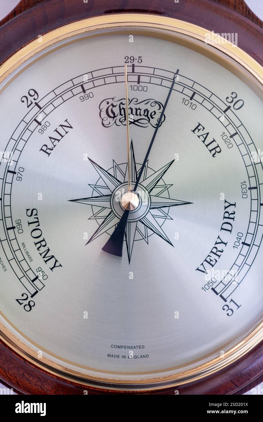 Close up of an aneroid barometer mounted on a wall Stock Photo - Alamy