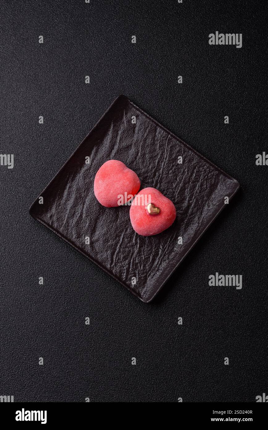 Delicious sweet mochi in the shape of red hearts for the holiday of ...