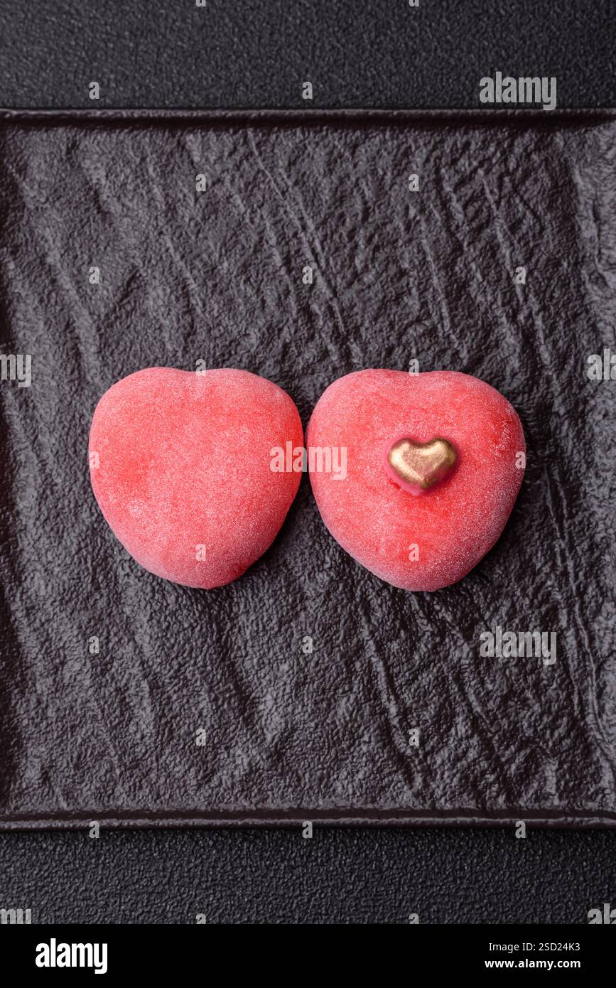 Delicious sweet mochi in the shape of red hearts for the holiday of ...
